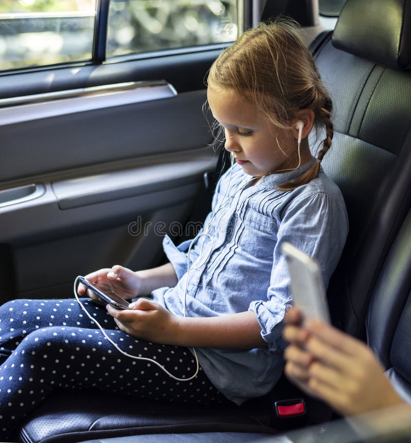 Girl in a Car Using a Digital Device Stock Image - Image of smiling ...