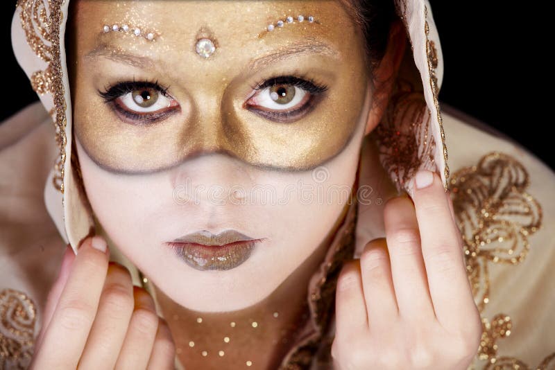 Girl in a Carnival Mask Painted on Her Face. Stock Photo - Image of ...