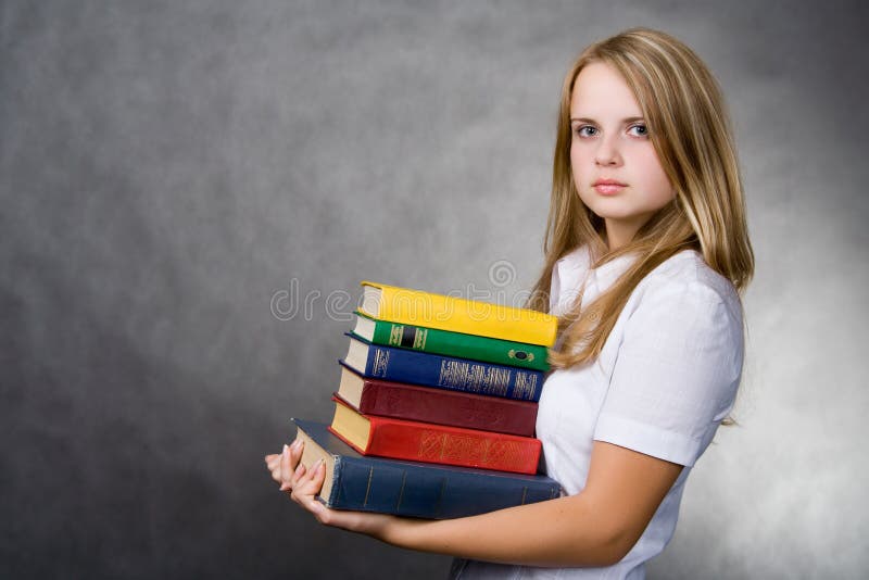Girl carrying books stock photo. Image of lift, literature - 1284304