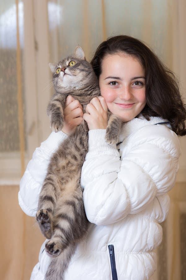 Girl with a cat stock photo. Image of beautiful, holding - 34640284