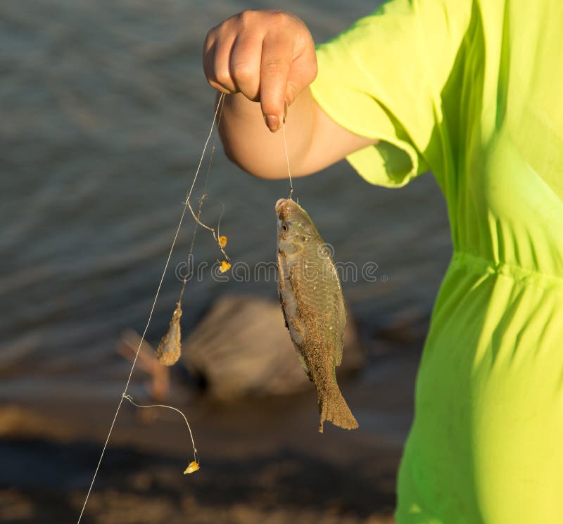 The Girl Caught the Fish on the Bait Stock Photo - Image of catch, lake ...