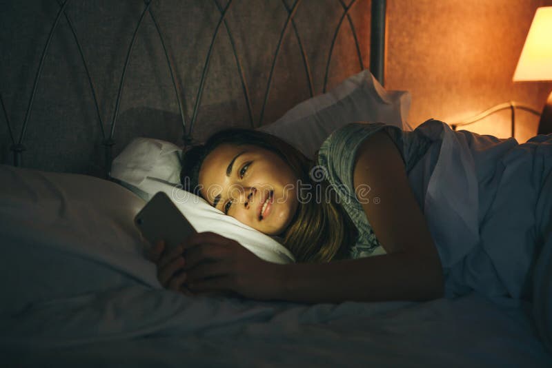 Girl with Cell Phone in Bed Stock Photo - Image of mobile, bedtime ...