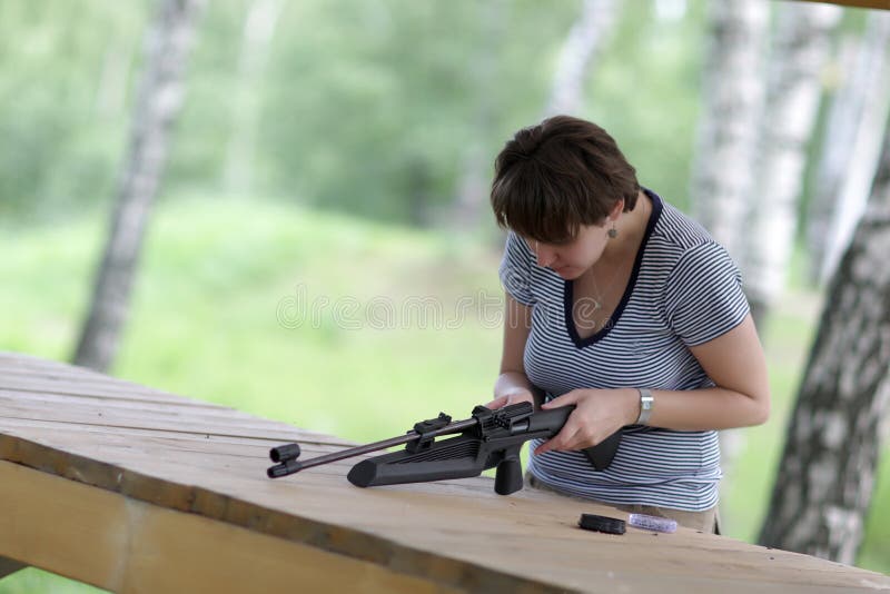 Girl charges air gun stock photo. Image of rifle, park - 14906458