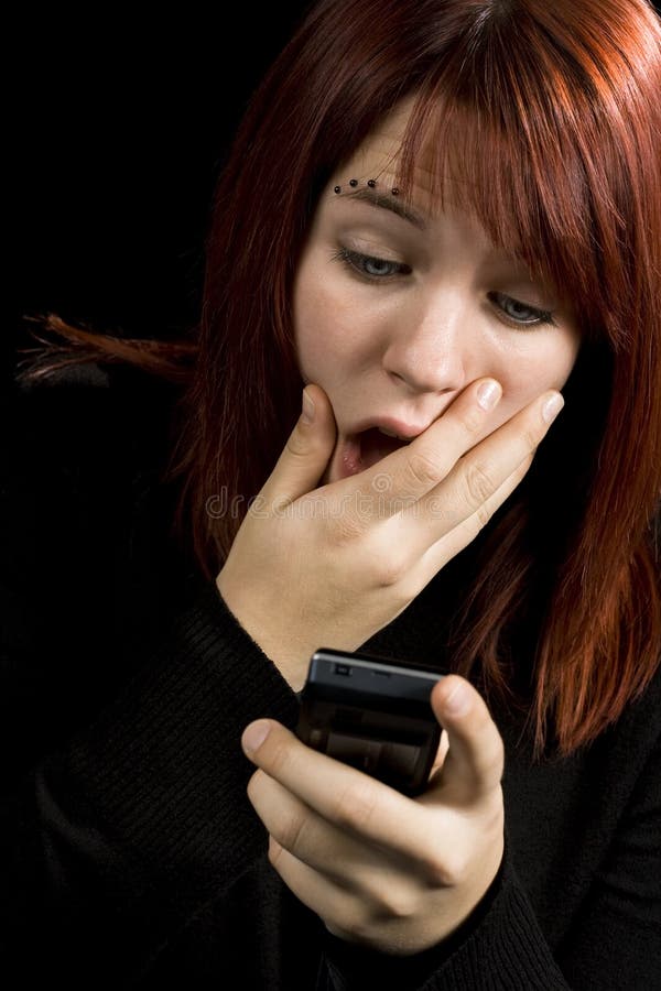 Teenager Horrified by Phone Stock Photo - Image of terrified, dropped ...