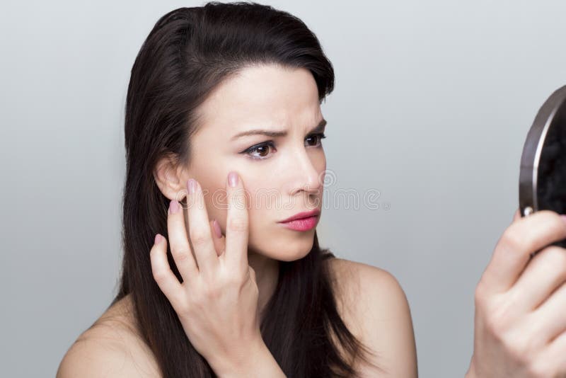 Girl checking wrinkles stock photo. Image of gorgeous - 52850510