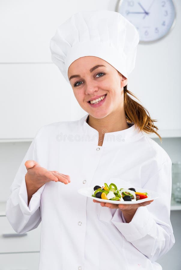 Girl in Chef`s Hat and White Coat Showing Salad Stock Image - Image of ...