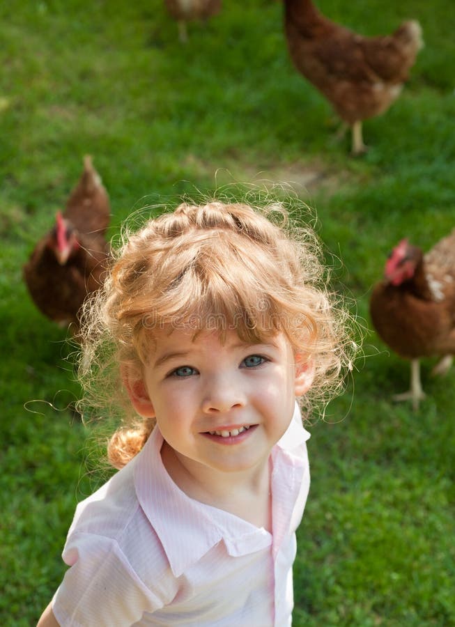 Girl and Chicken stock image. Image of pecking, lawn - 19657837