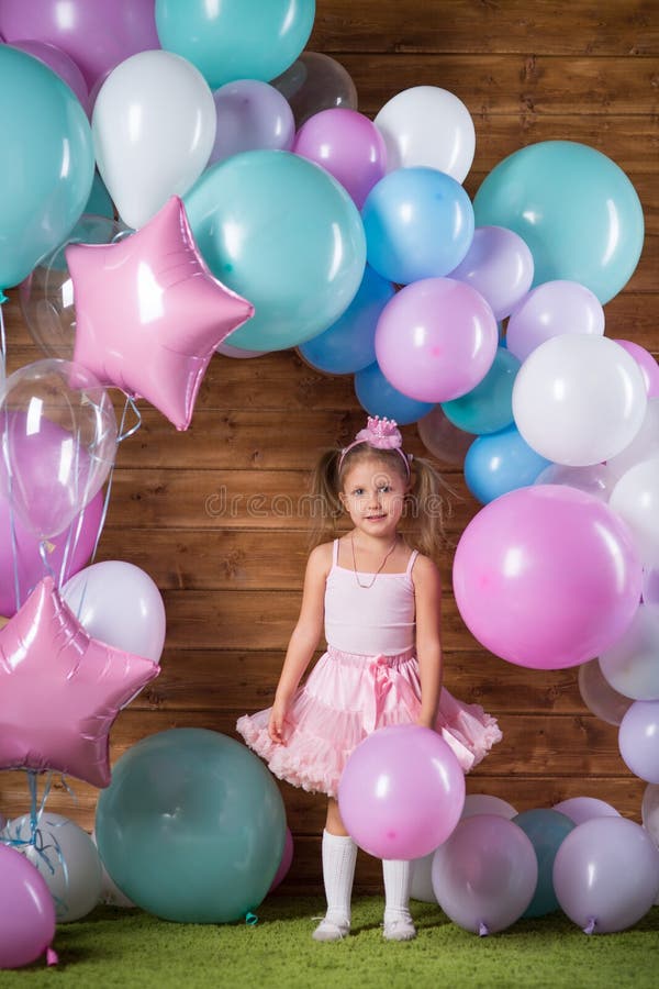 Girl child with balloons stock photo. Image of child - 138442334