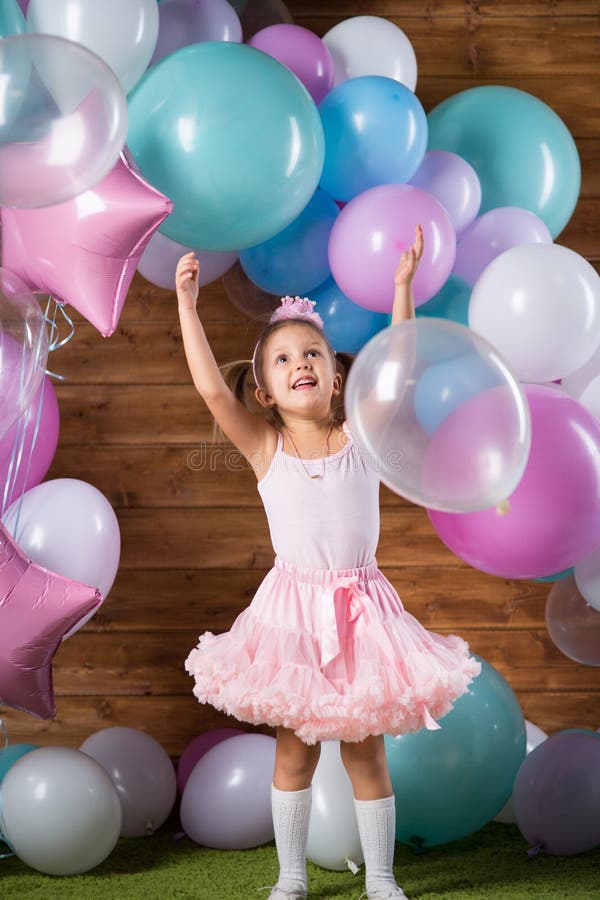 Girl child with balloons stock image. Image of beauty - 138442413