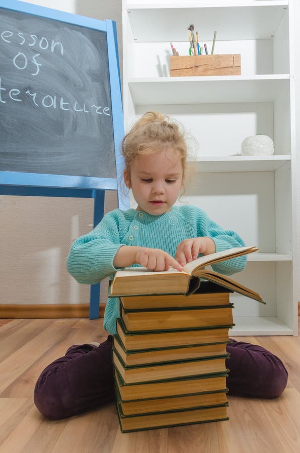 Elementary School Student with a Book Stock Photo - Image of classroom ...