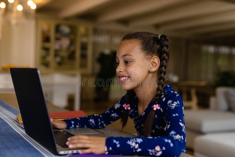 Girl Child Using Laptop and Smiling at Home, with Striped Runner and ...