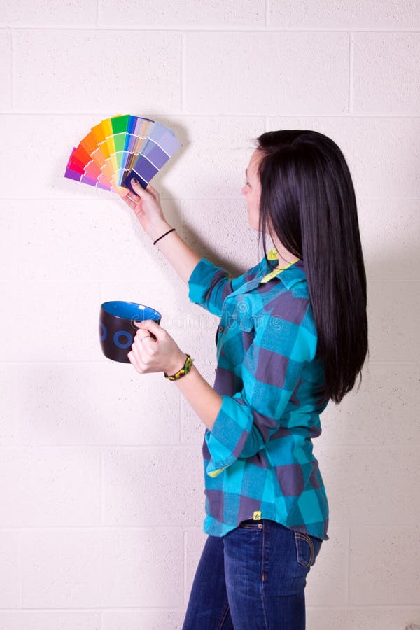 Girl Choosing a Color for the Walls Stock Photo - Image of selecting ...