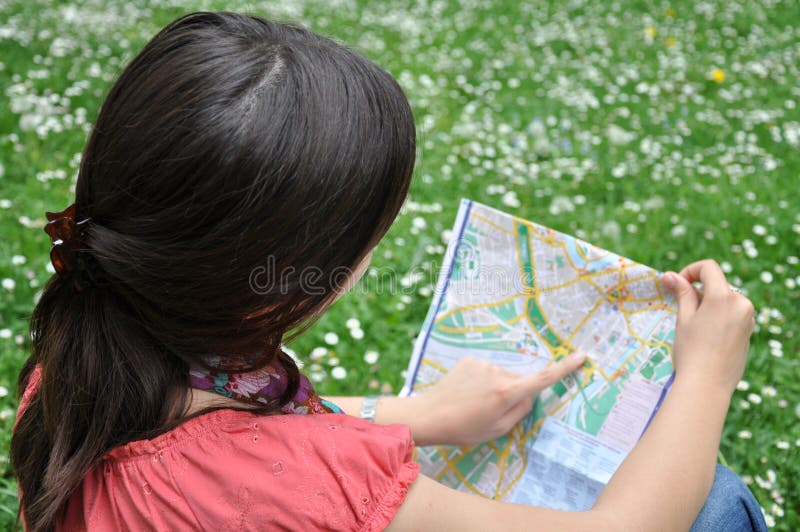 Woman reading map. stock photo. Image of navigation, indoors - 3470280