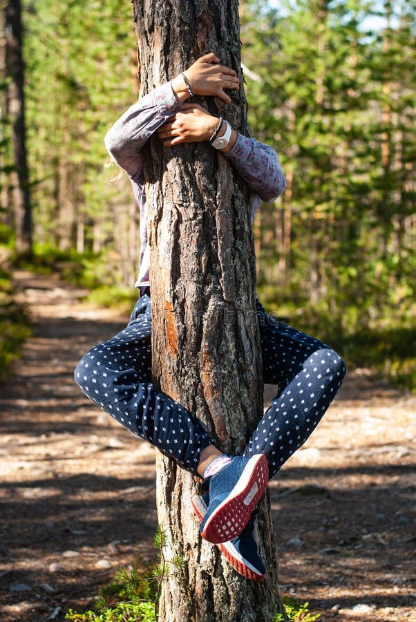 Girl Clasped the Tree Trunk with Her Arms and Legs Stock Photo - Image ...