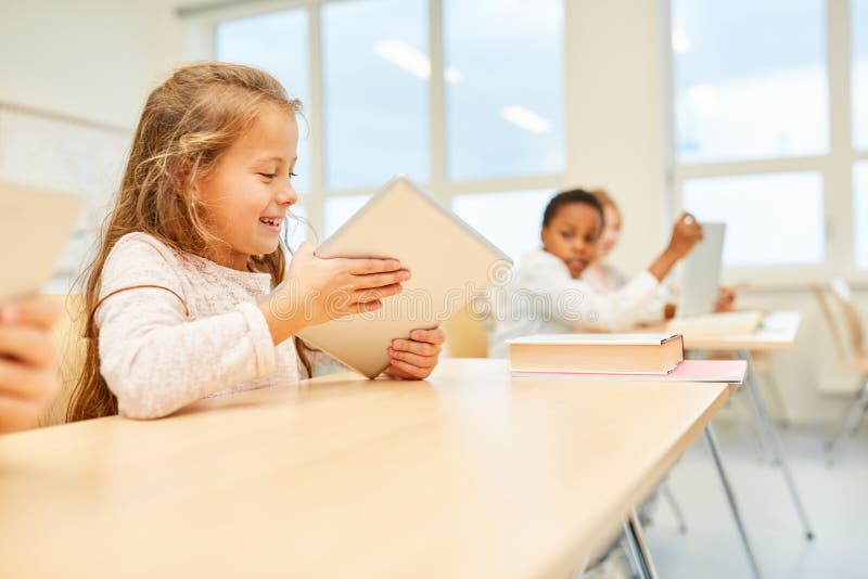 Girl in Elementary School Class Stock Image - Image of school, thought ...