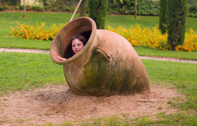 Girl in clay jar stock photo. Image of pretty, girl, pottery - 25612532