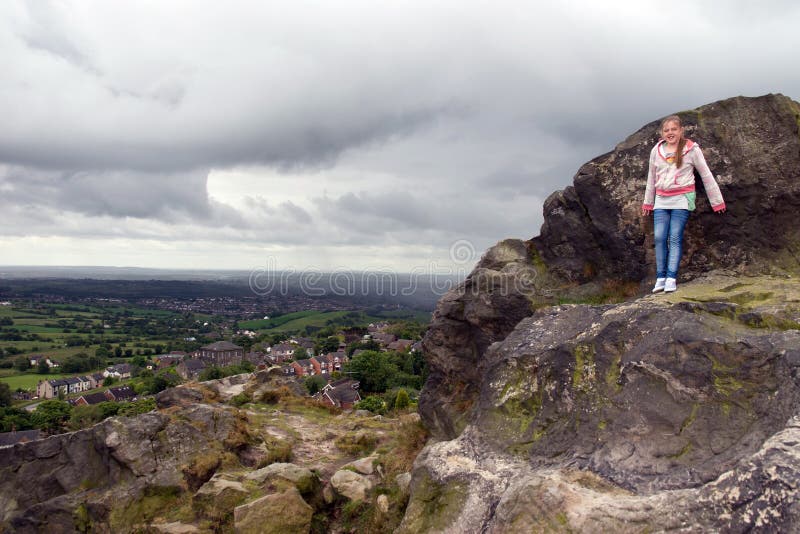 Girl on Cliff with View of English Countryside Stock Photo - Image of ...