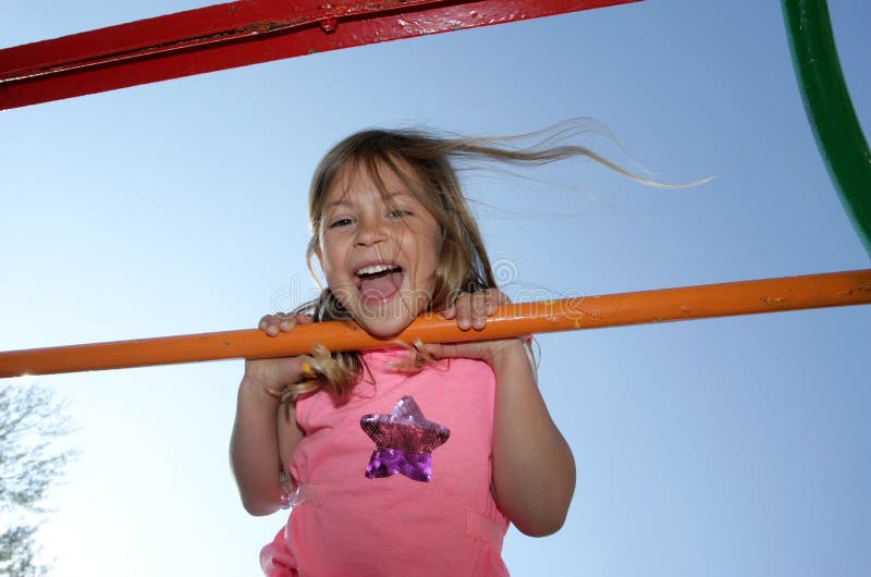 Girl on climbing frame stock photo. Image of playing - 14487998