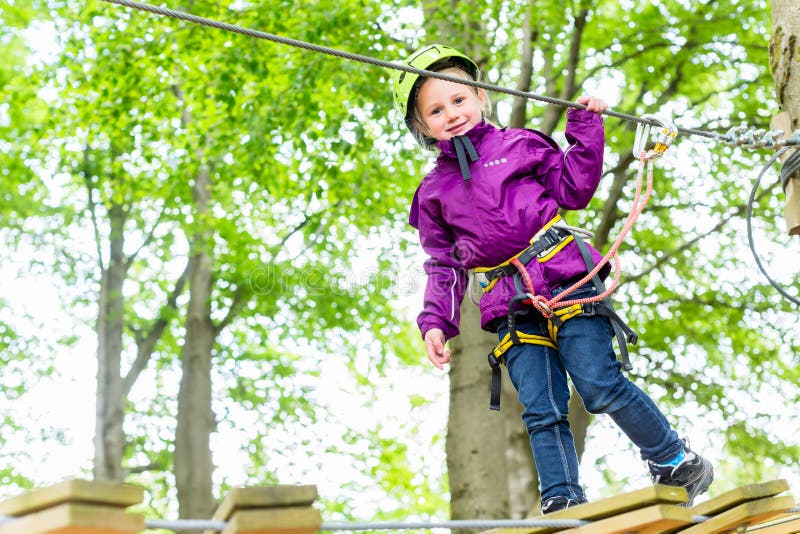 Girl Climbing in High Rope Course Stock Image - Image of ropes, tree ...
