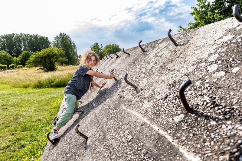 The Girl Climbs on the Concrete Wall Stock Photo - Image of park ...