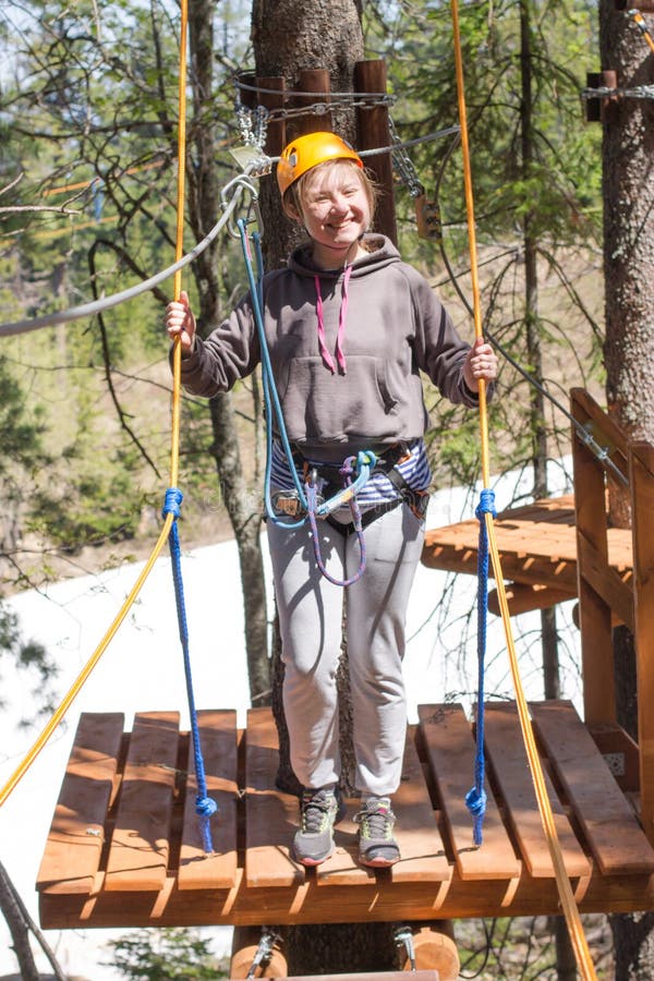 Girl Climbs into Ropes Course Stock Photo - Image of holiday ...