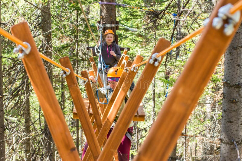 Girl Climbs into Ropes Course Stock Image - Image of high, nature: 73067853