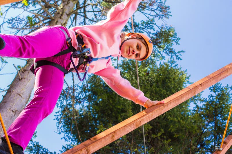 Girl Climbs into Ropes Course Stock Image - Image of holiday, height ...
