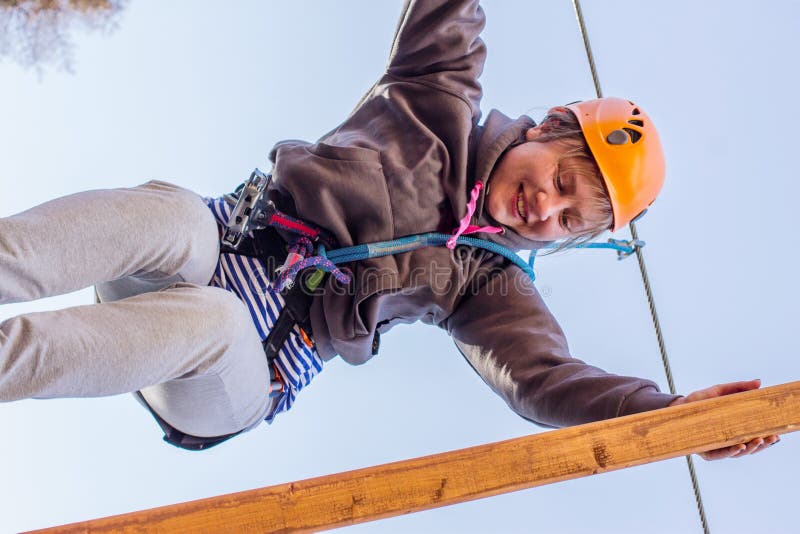 Girl Climbs into Ropes Course. Bike Stock Photo - Image of people, park ...