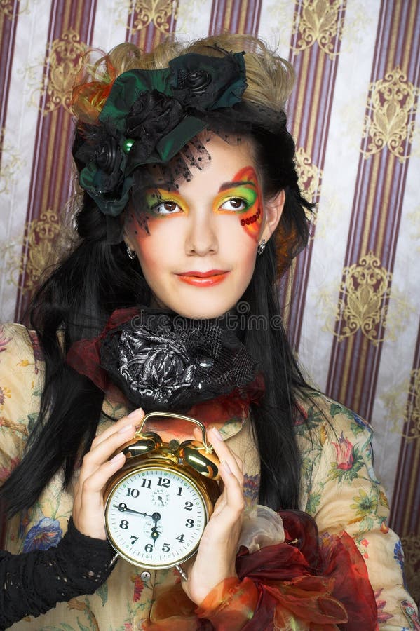Girl with clock. stock photo. Image of person, hand, brunet - 40089242