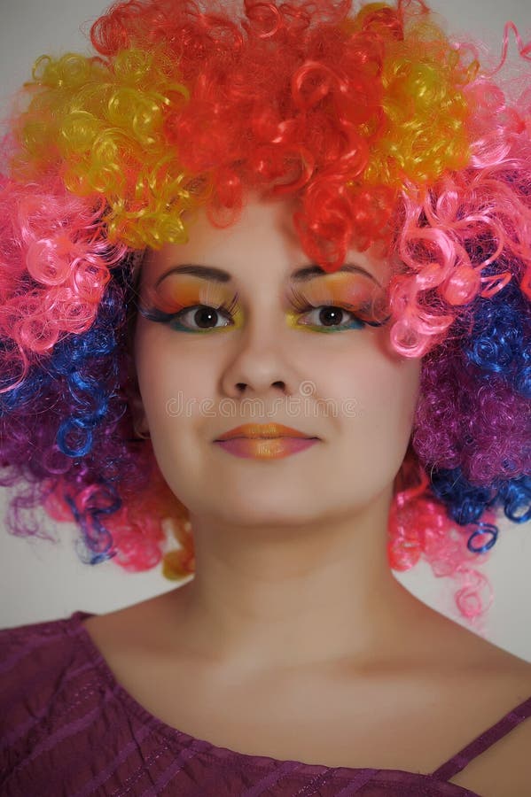 Girl in a clown wig stock photo. Image of hand, blow - 111078286