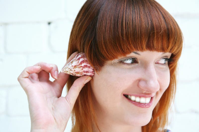 Girl with a cockleshell stock image. Image of girl, smile - 12771483