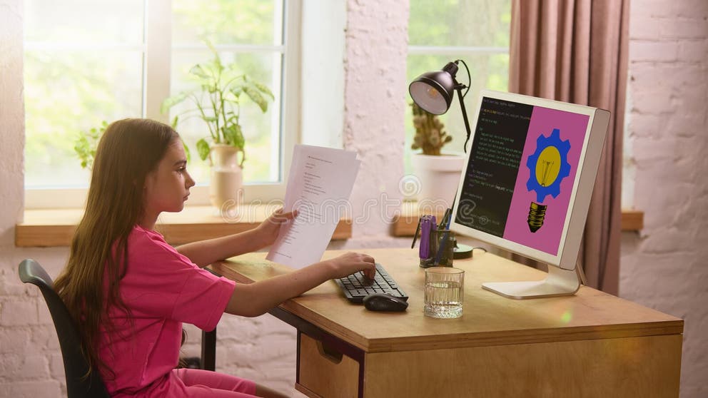 Girl Coding and Reviewing Papers at Home Desktop Computer. Fake Code on ...