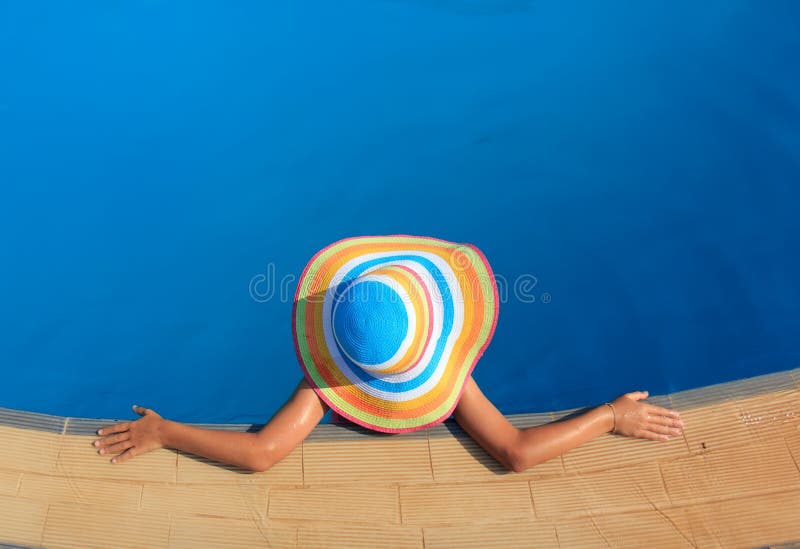 Girl with Colorful Hat in the Pool Stock Image - Image of beauty, blue ...
