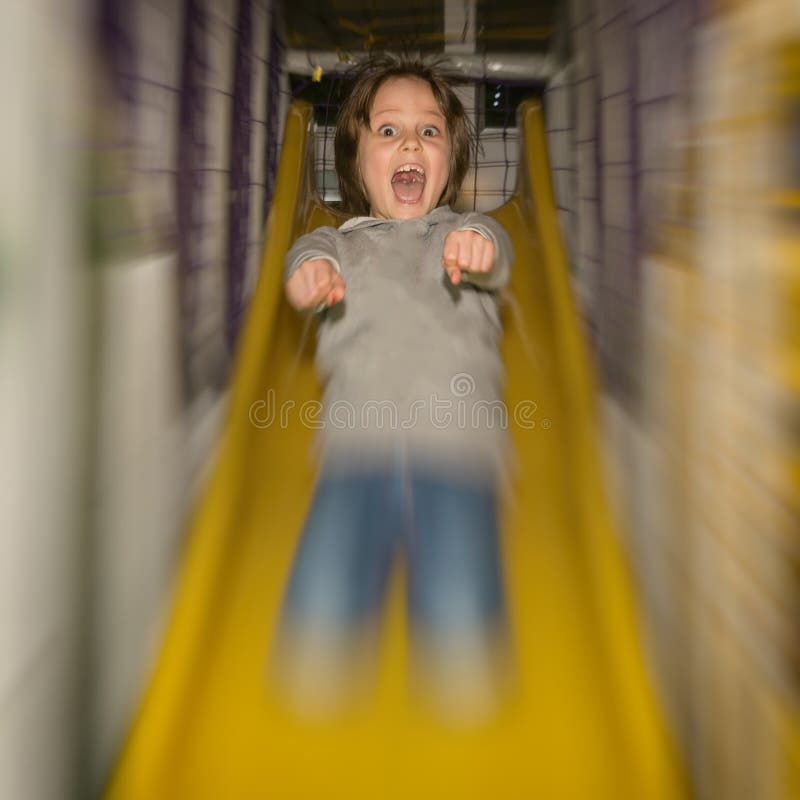 Girl coming down the slide stock photo. Image of close - 93424138