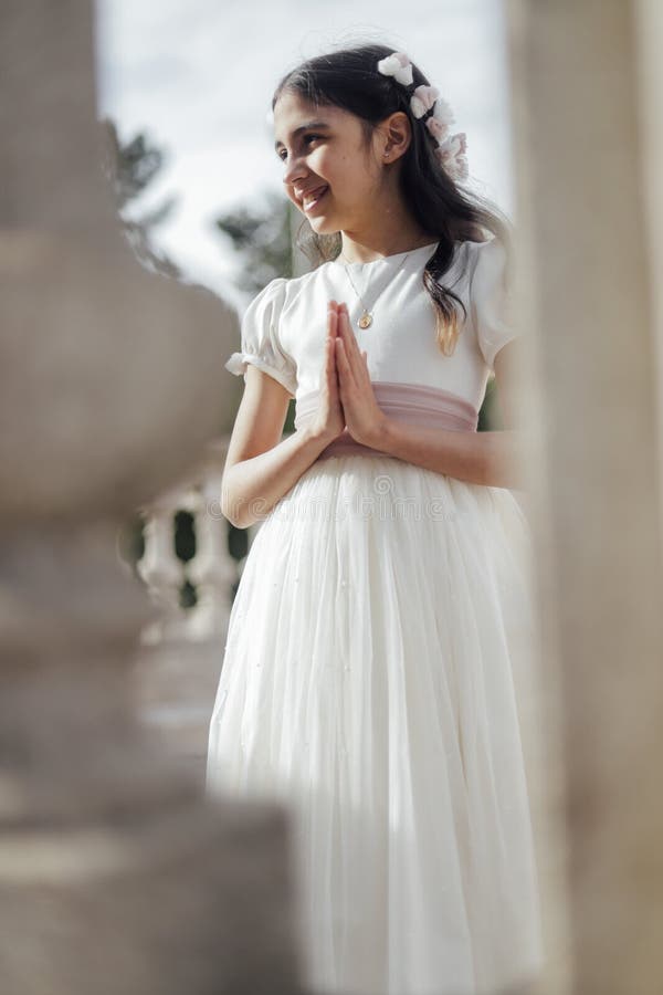 Girl with communion dress stock image. Image of catholic - 242284993