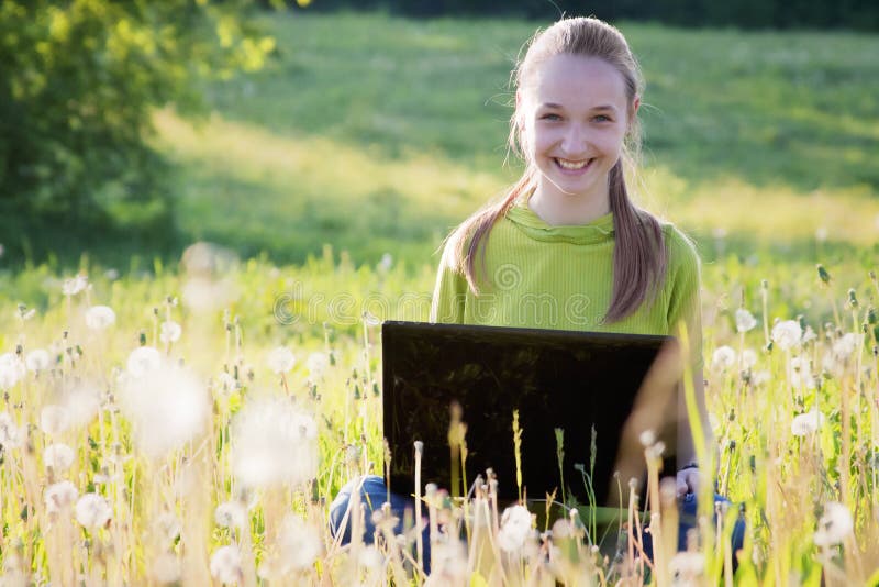 Girl with computer stock image. Image of meadow, copy - 23519745