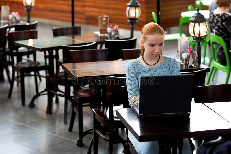 Man and Woman Couple in the Cafe on Laptop Computer. Stock Image ...