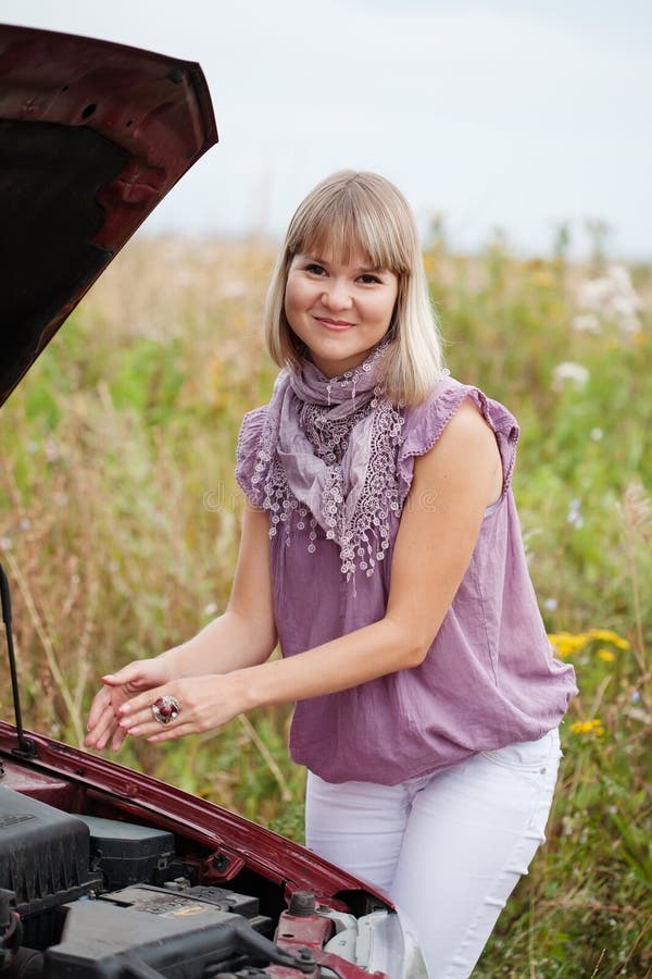 Girl considers the engine stock photo. Image of auto - 21328968