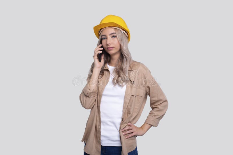 Girl Construction Worker Seriously Talking on Phone Watching Front ...