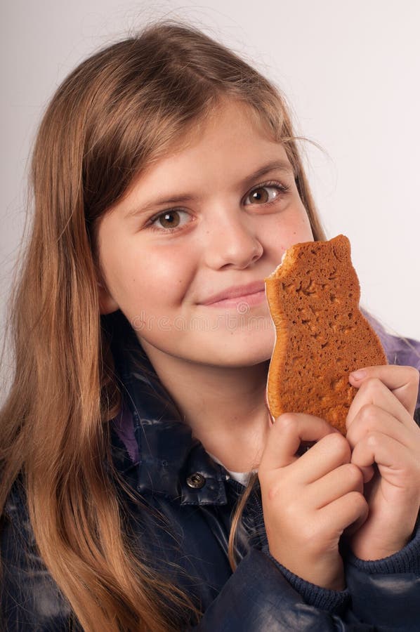 Girl with cookie stock image. Image of grey, blonde, brown - 61923653