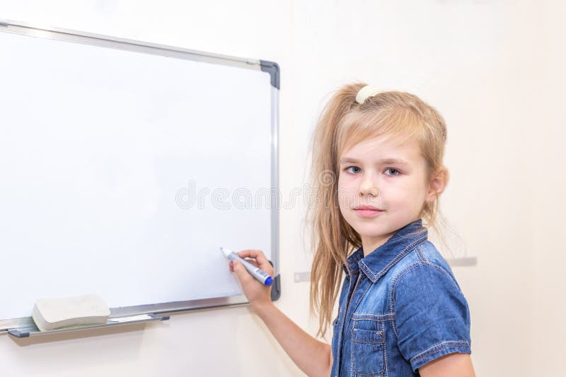 Girl with Copy Space on Empty Whiteboard with a Marker Pen. Stock Photo ...