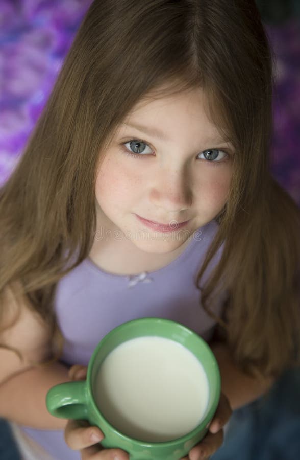 Girl with a cup of milk stock photo. Image of happiness - 72910184