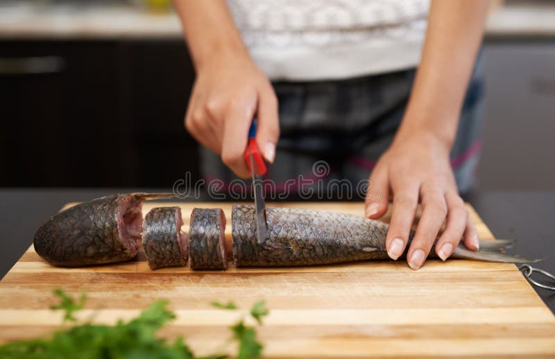 Girl Cuts Fish To Prepare Dinner Stock Photo - Image of cutting ...