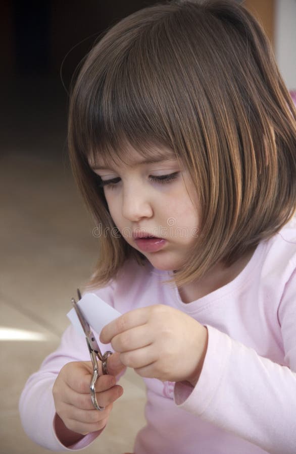 Girl cutting paper stock photo. Image of smile, plucking - 34524410