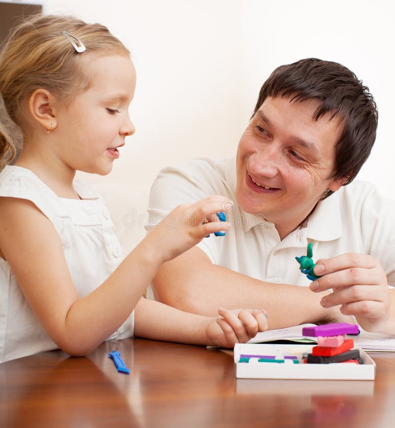 Girl and Dad Molded from Clay Toys Stock Image - Image of girls, people ...
