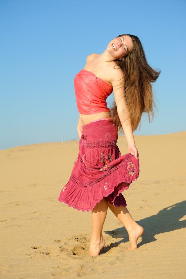Girl dances on the sand stock image. Image of outdoor - 21211681