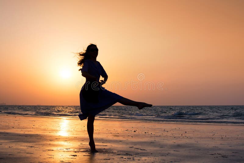 Girl Dancing on the Beach at Sunset Stock Photo - Image of golden ...