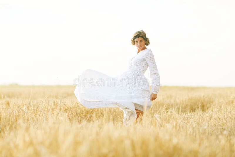 Girl Dancing in Field in White Dress Stock Photo - Image of outdoor ...