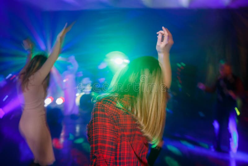 The Girl is Dancing with Her Back on the Dance Floor. Multicolored ...