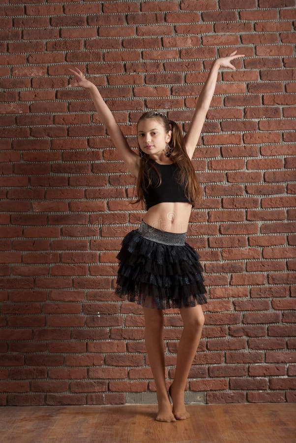 Girl Dancing Near Brick Wall Stock Image - Image of brick, girl: 24350555